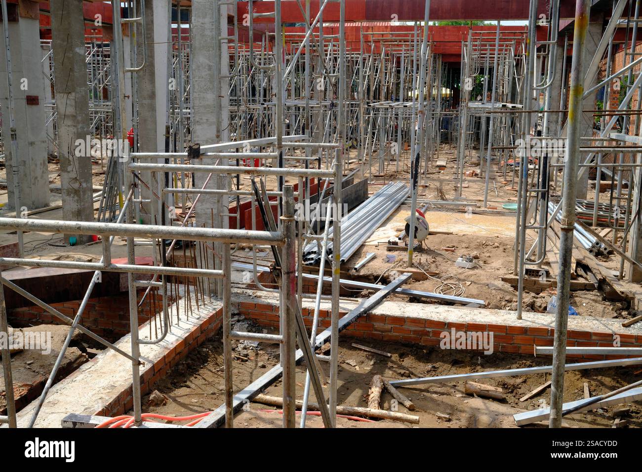 Setting up scaffolding on a construction site. Tan Chau. Vietnam Stock ...