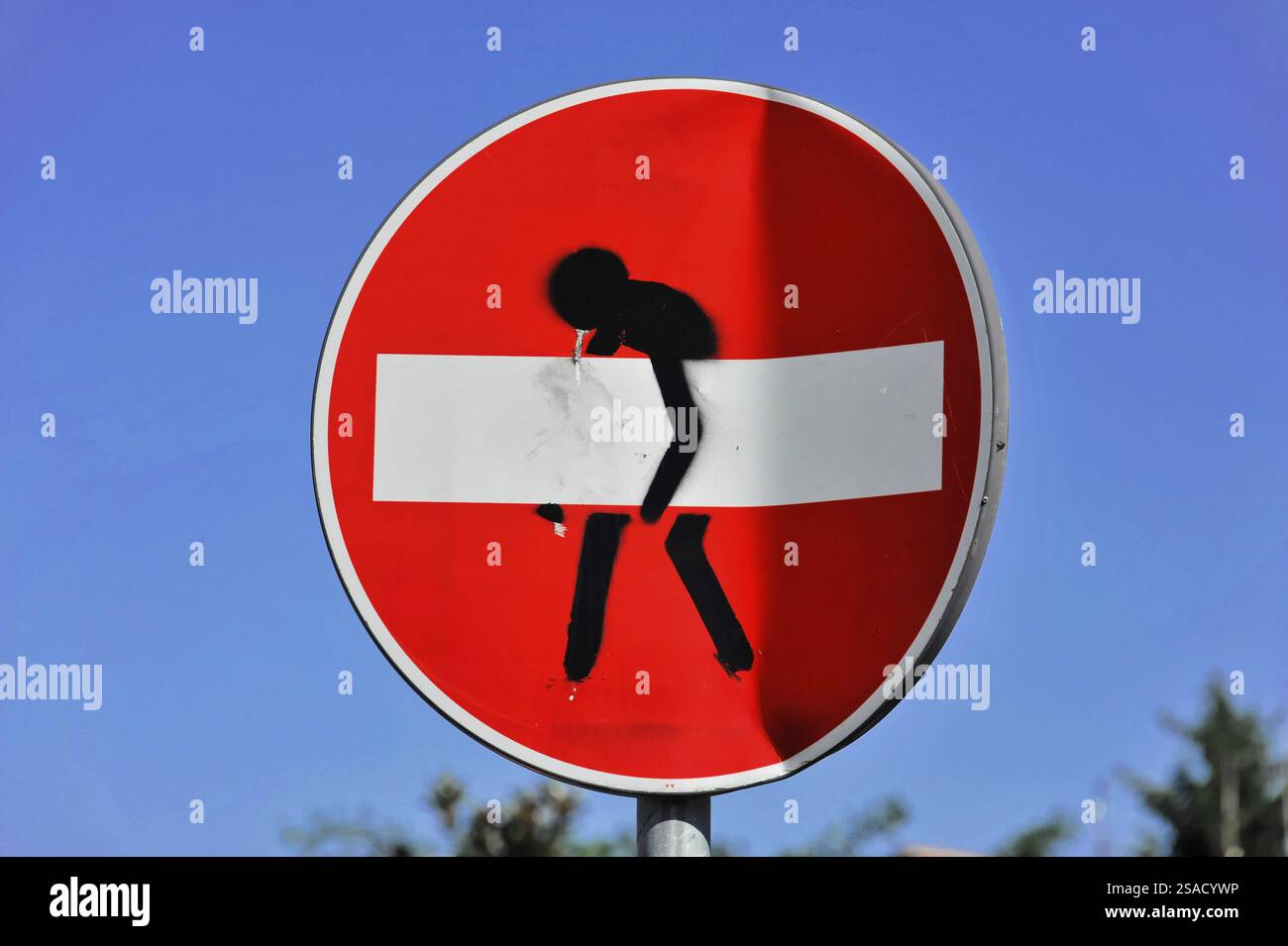 A road sign with creative graffiti depicting a person interacting with ...