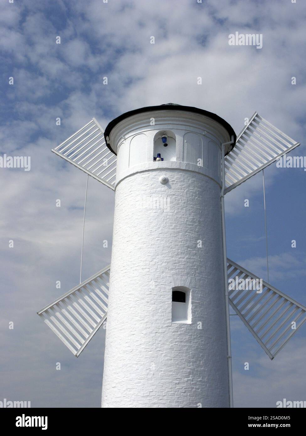The landmark of Swinoujscie: a white lighthouse in the shape of a mill ...