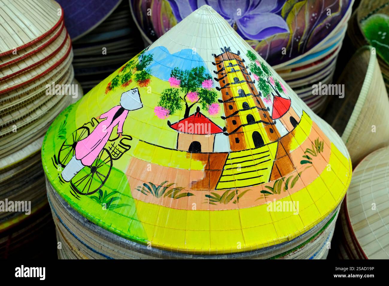 Paddy hats or conical straw hats for sale at a market stall in Dong Ba ...