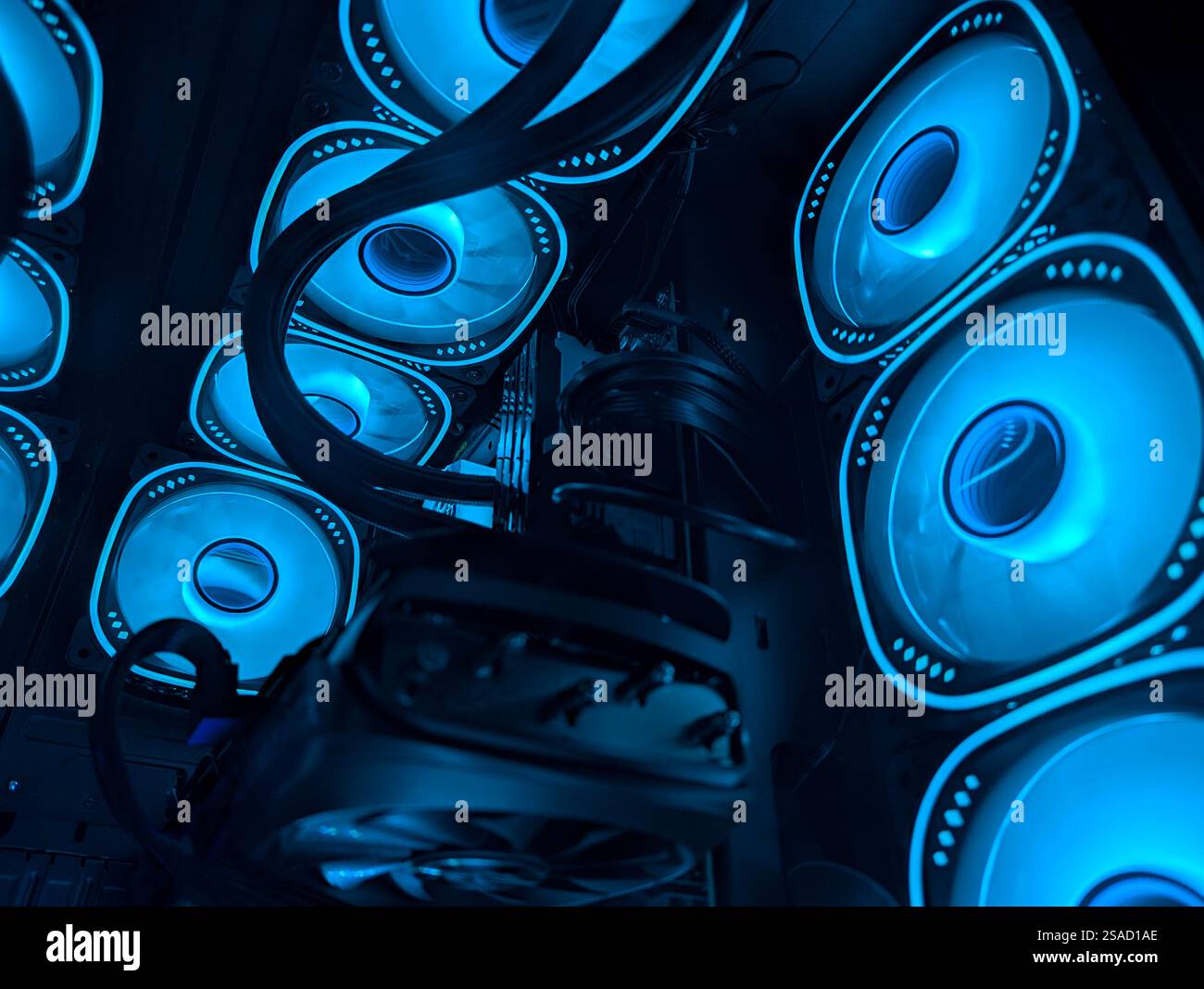 Multiple cooling fans emit blue light, showcasing efficient airflow and ...