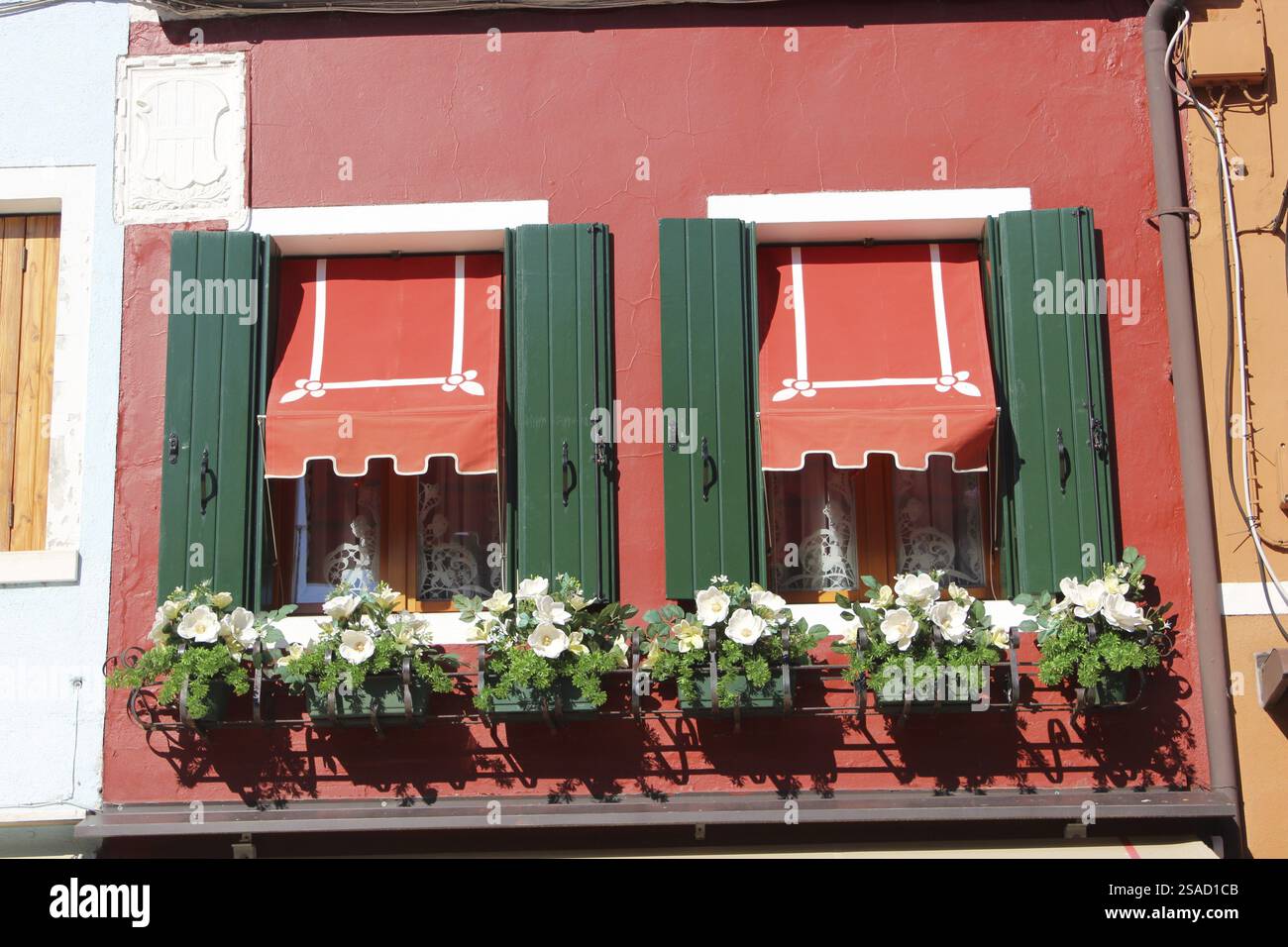 Windows on the island of Burano Stock Photo - Alamy