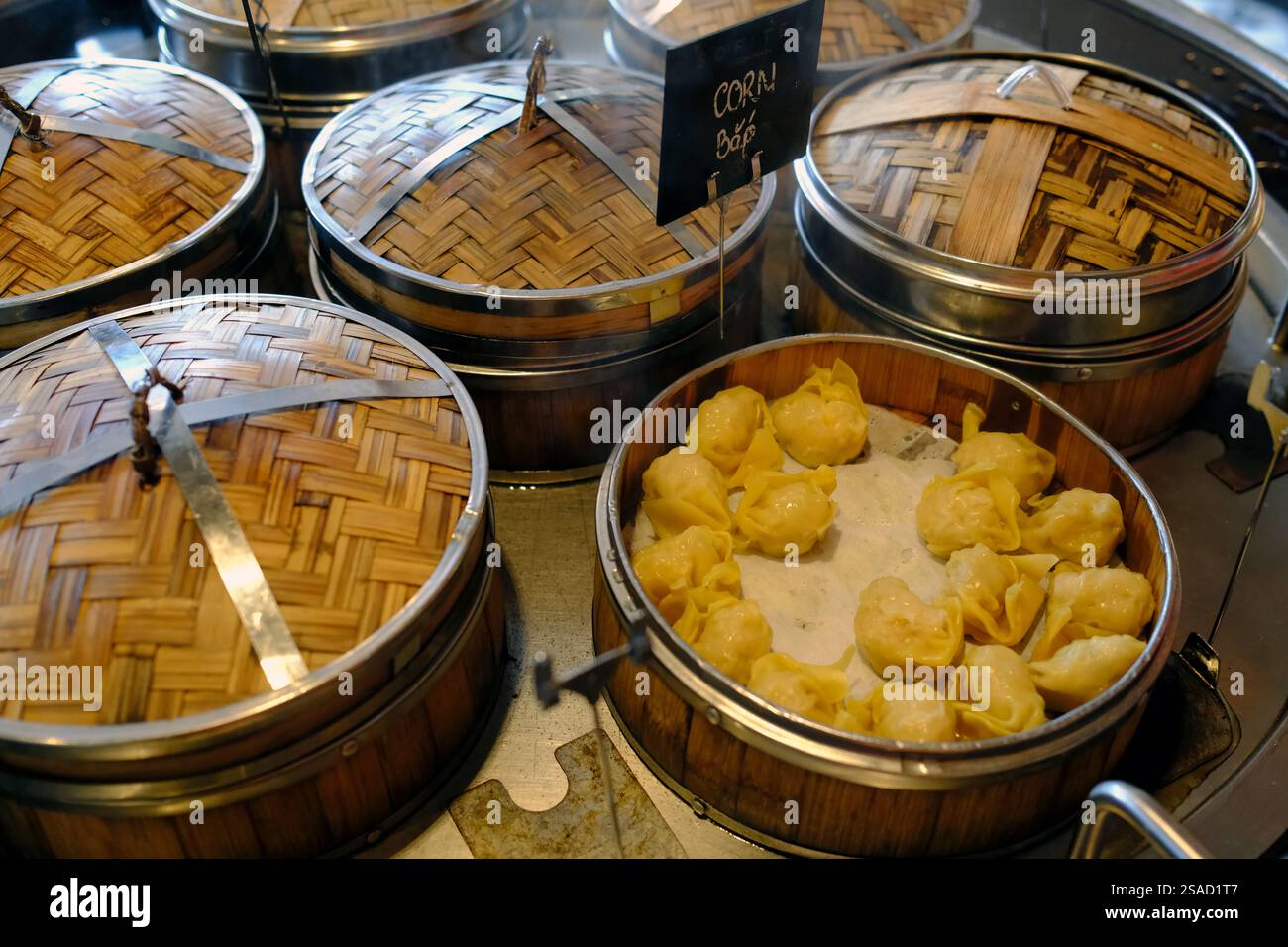 Dim sum and dumpling buffet in a restaurant. Steamer baskets Stock ...
