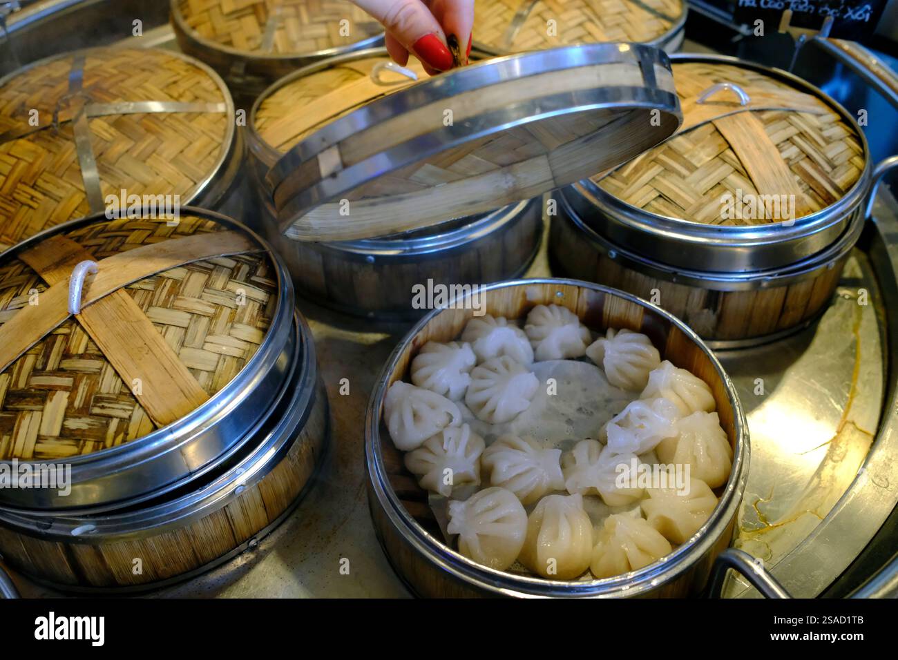 Dim sum and dumpling buffet in a restaurant. Steamer baskets Stock ...