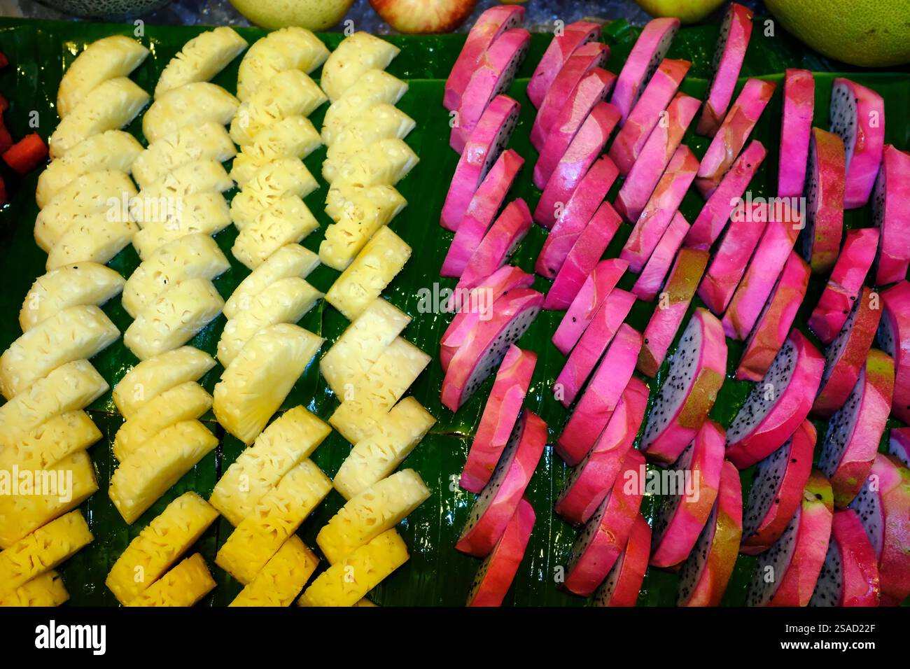 Fresh tropical fruits buffet in a restaurant. Pineaple, dragon fruit ...