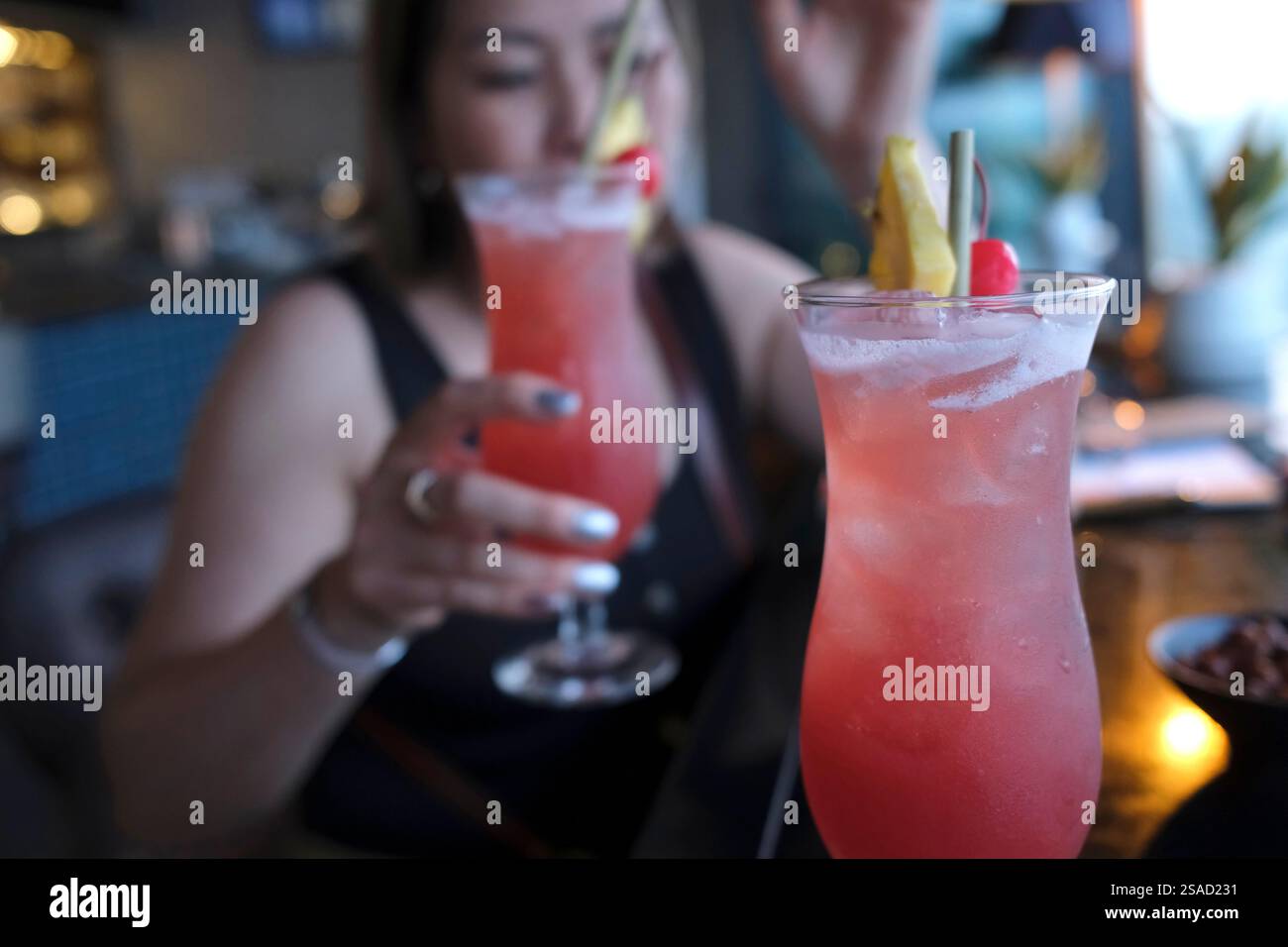 Cocktail bar. Glass of Singapore Sling. Hue. Vietnam Stock Photo - Alamy