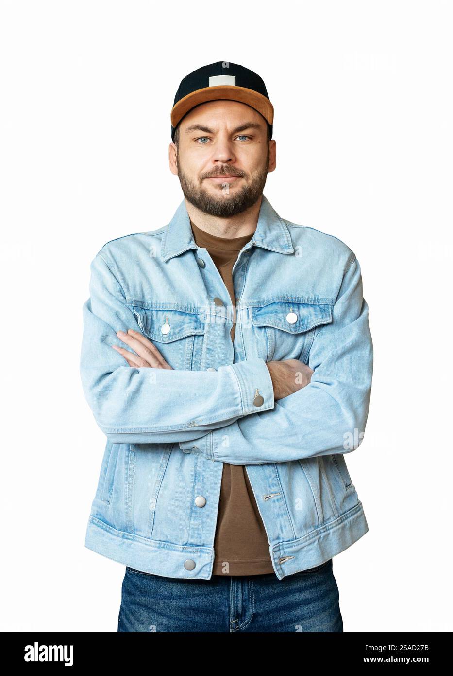 Young adult man with short beard wearing denim jacket and snapback cap ...