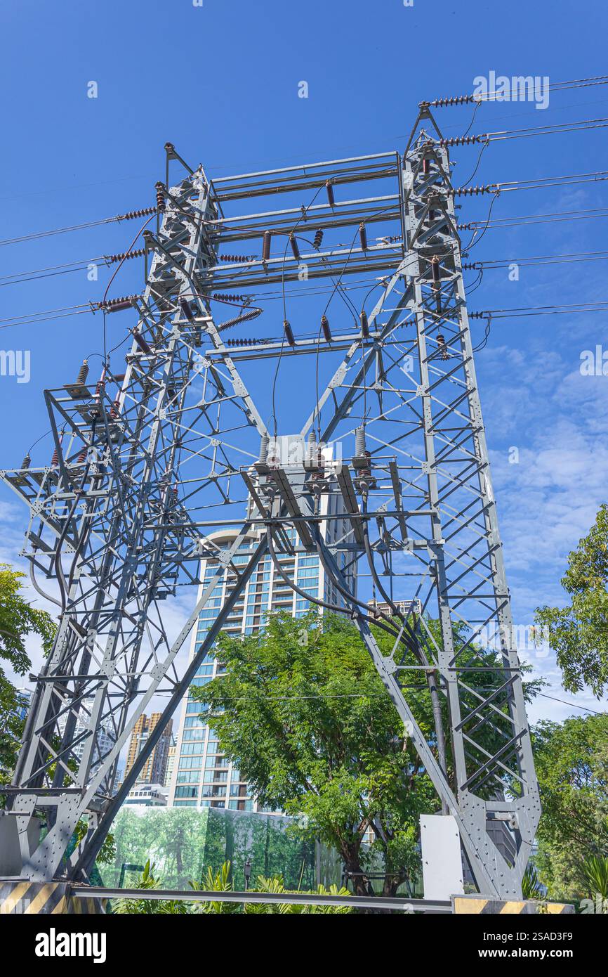 The image of an electric transmission tower against a blue sky ...