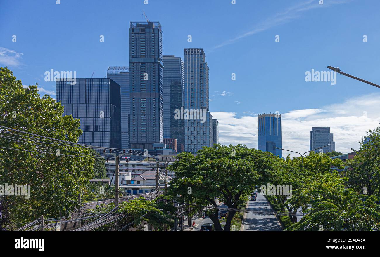 A stunning urban skyline showcases modern architecture under a clear ...