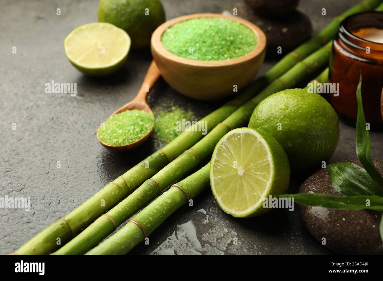 Spa composition with wet limes, sea salt, pebble stone and bamboo on ...