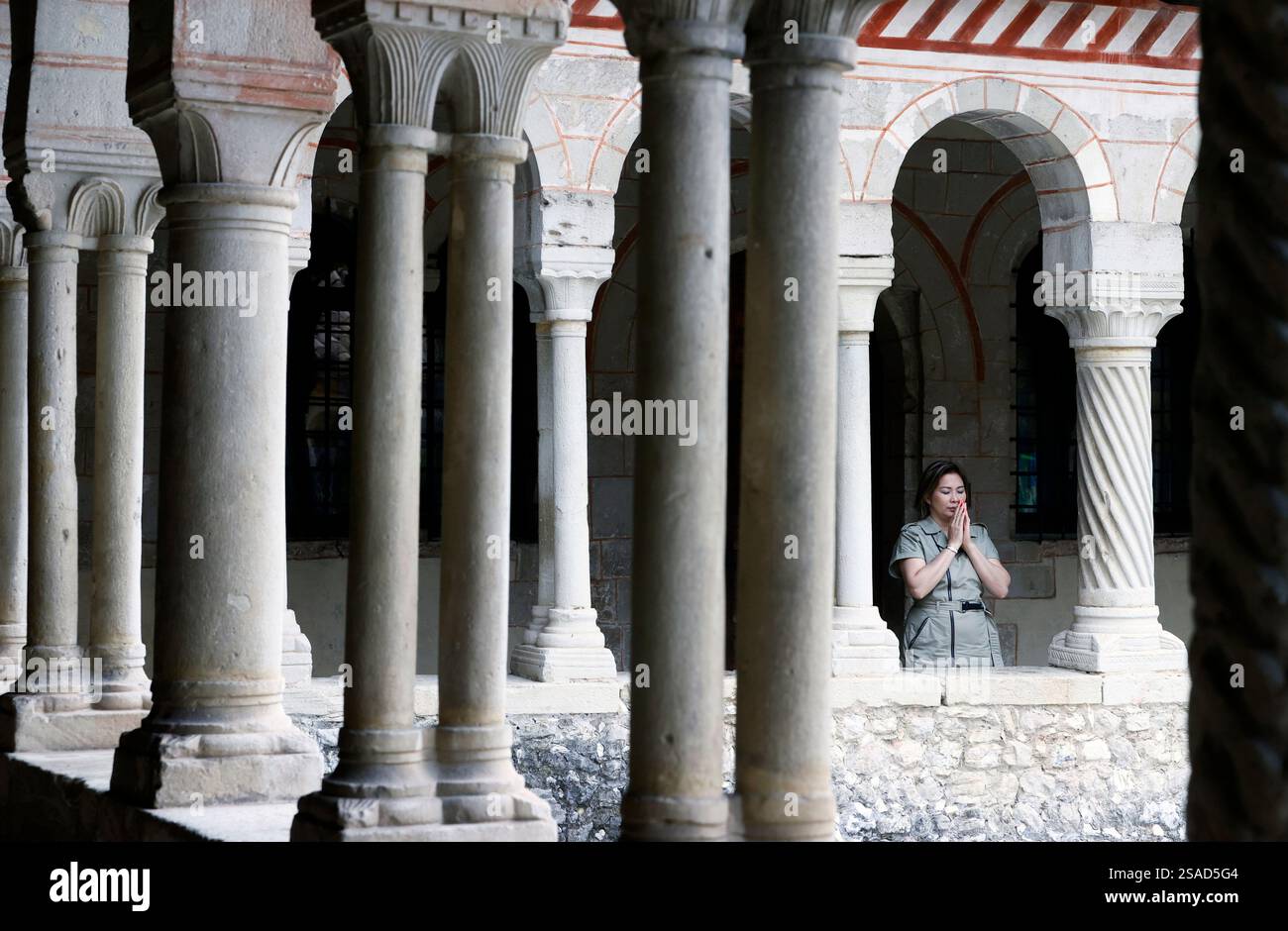 Cistercian Abbey of Santa Maria di Follina. Woman praying in the ...