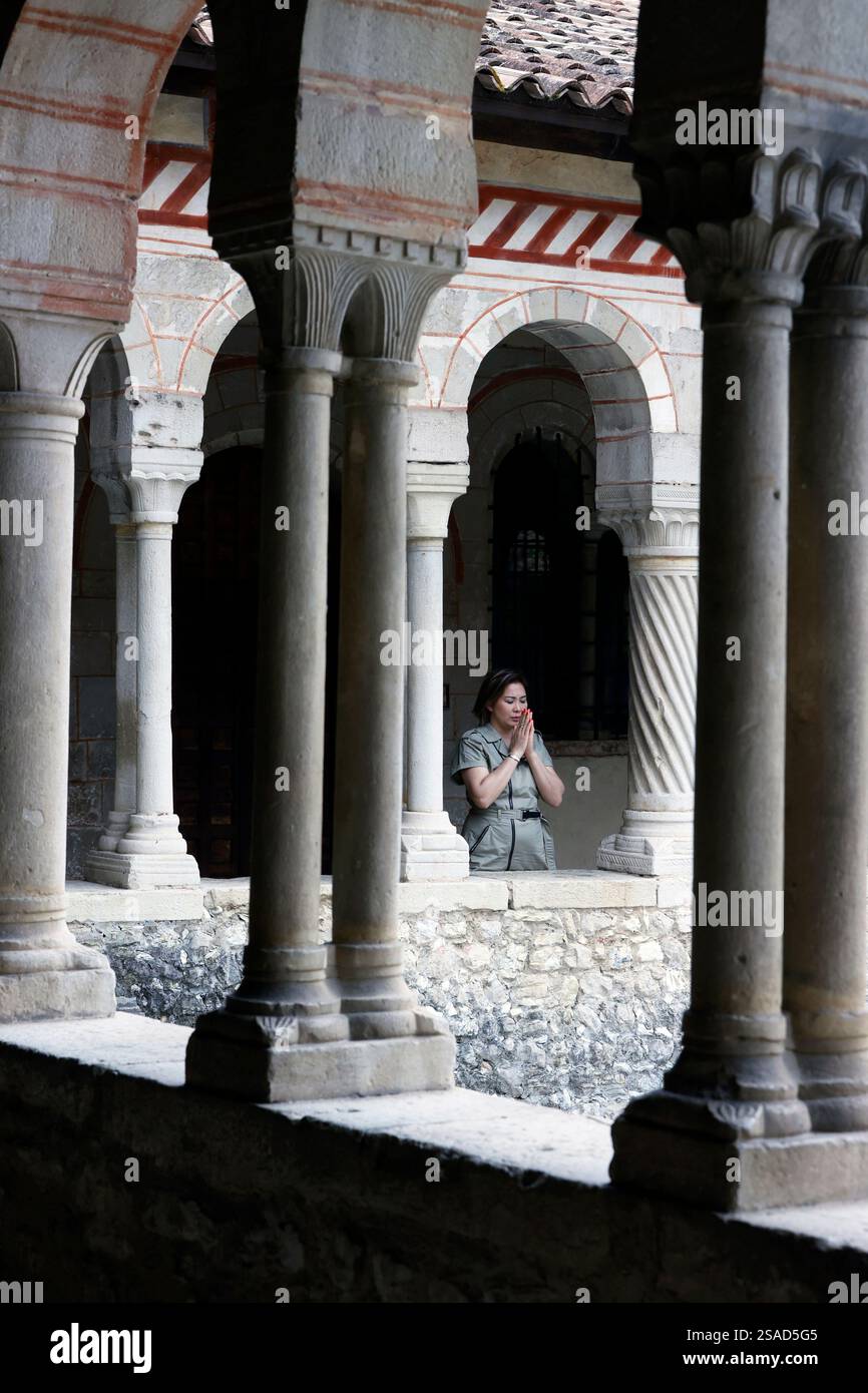 Cistercian Abbey of Santa Maria di Follina. Woman praying in the ...