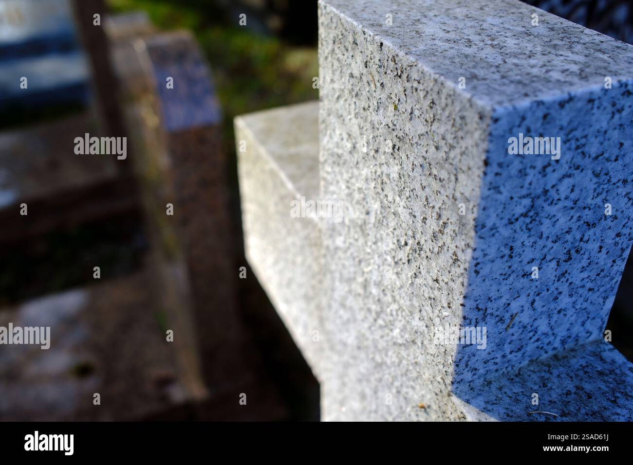 Granite cross on a grave. Cemetery Stock Photo - Alamy