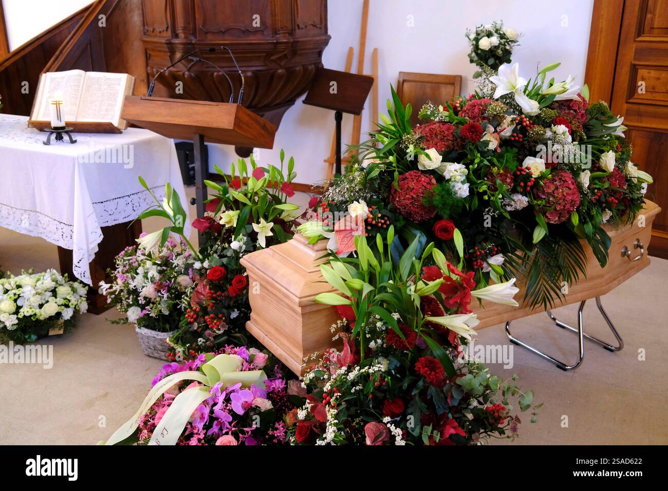 Flowers at the coffin, farewell to a dear deceased. Funeral service in ...