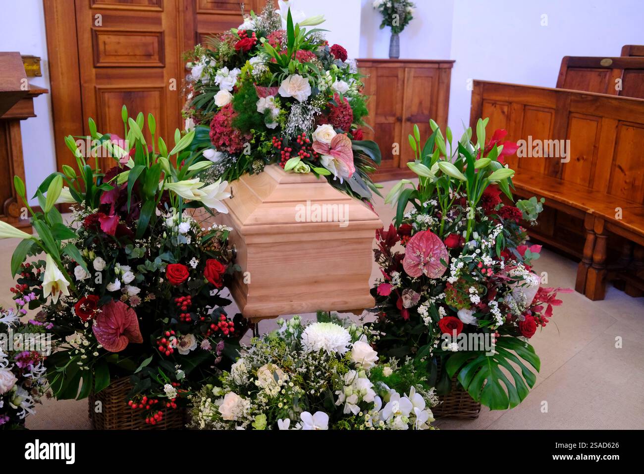 Flowers at the coffin, farewell to a dear deceased. Funeral service in ...
