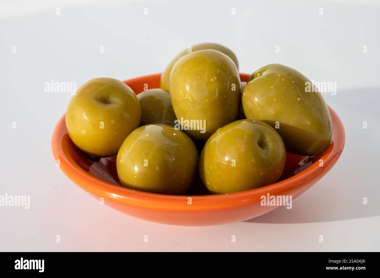 Homemade pickled big green olives in bowl, spanish tapas close up on ...