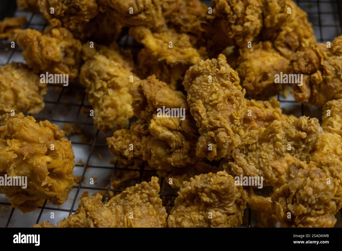 Close-up background of crispy fried chicken nuggets, showcasing a ...