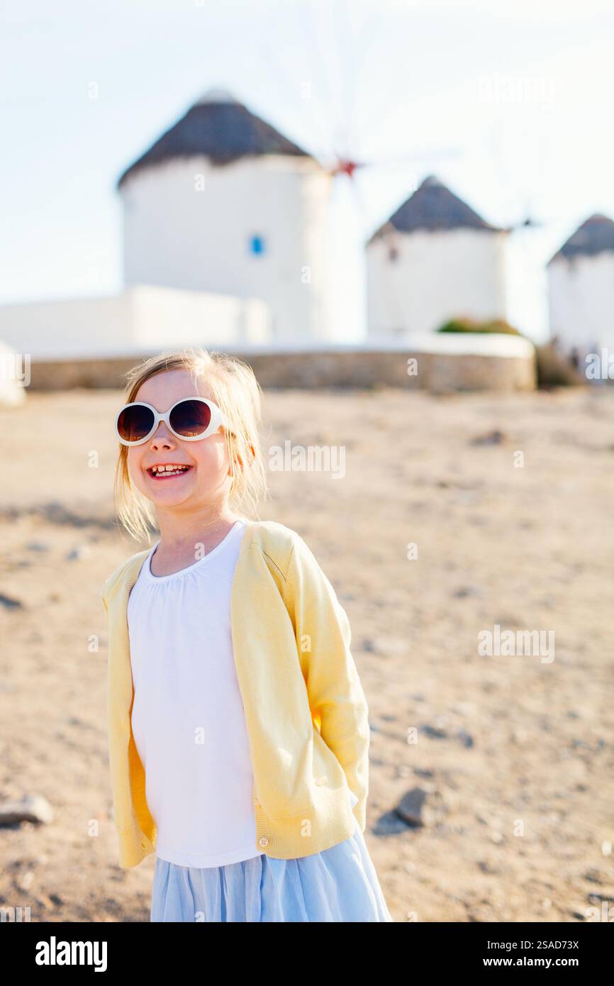 Cute little girl in front of windmills at popular tourist area on ...