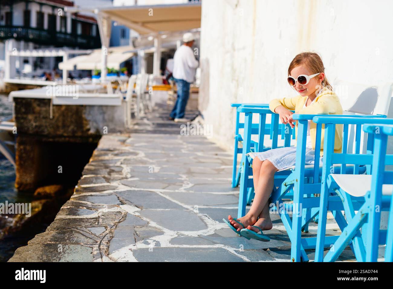 Cute little girl at Little Venice popular tourist area on Mykonos ...