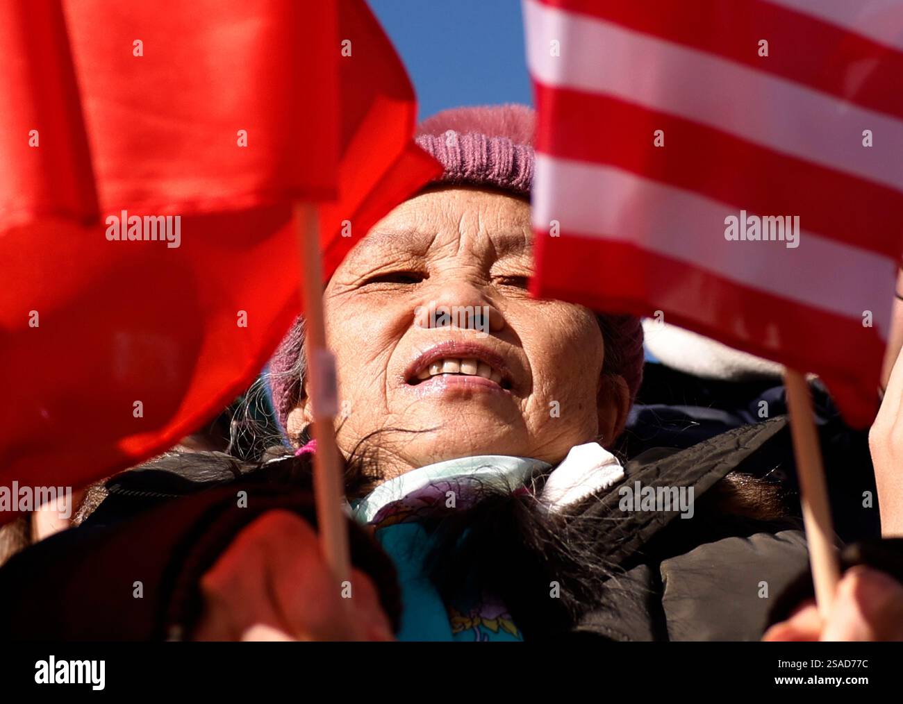 New York, United States. 29th Jan, 2025. Revelers hold flags as they ...