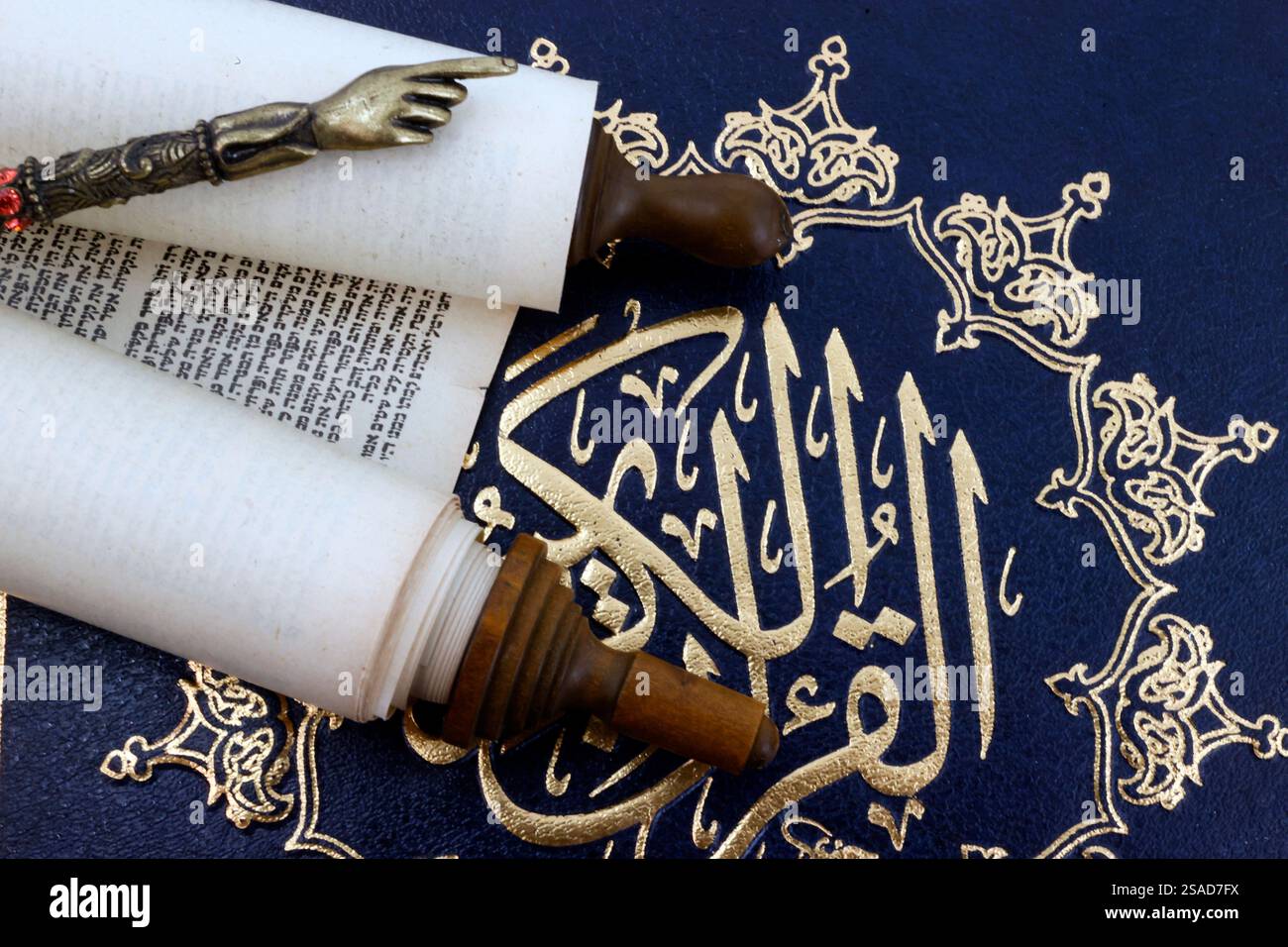 Torah scrolls in Hebrew, yad and quran in Arabic. Relationship between ...