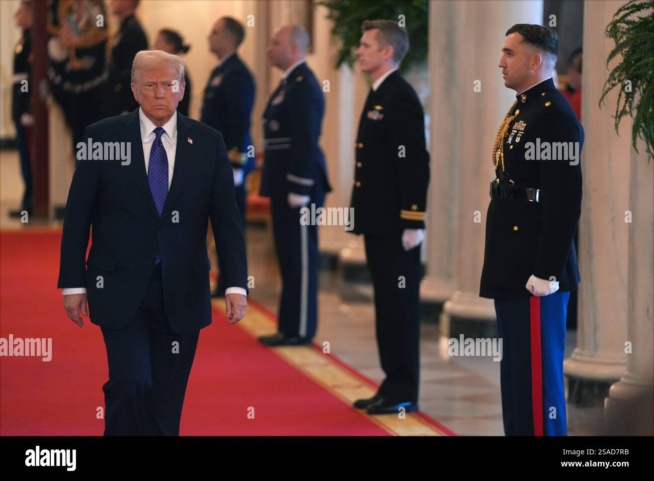 President Donald Trump arrives to sign the Laken Riley Act in the East ...
