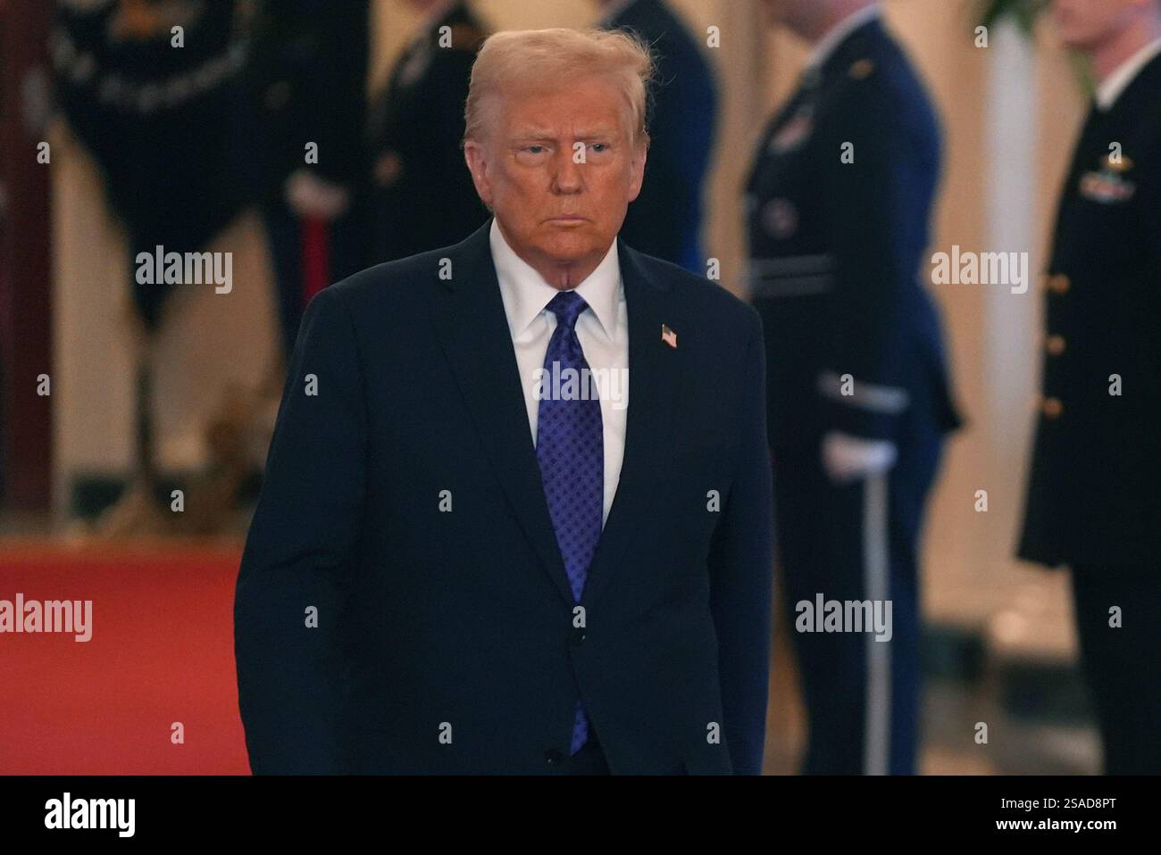 President Donald Trump arrives to sign the Laken Riley Act in the East ...
