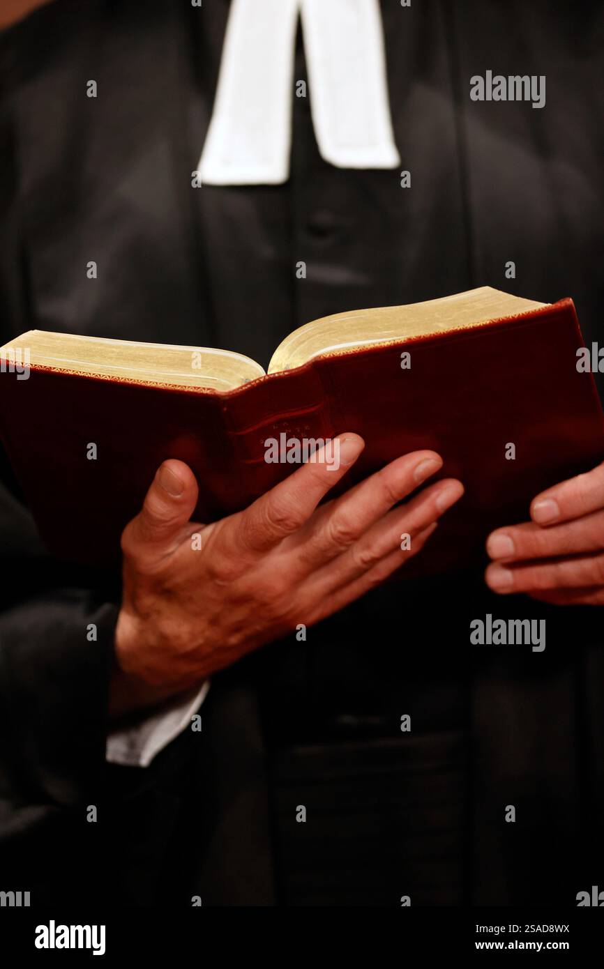 Sunday service in a Protestant church. Pastor reading the Bible. Paris ...