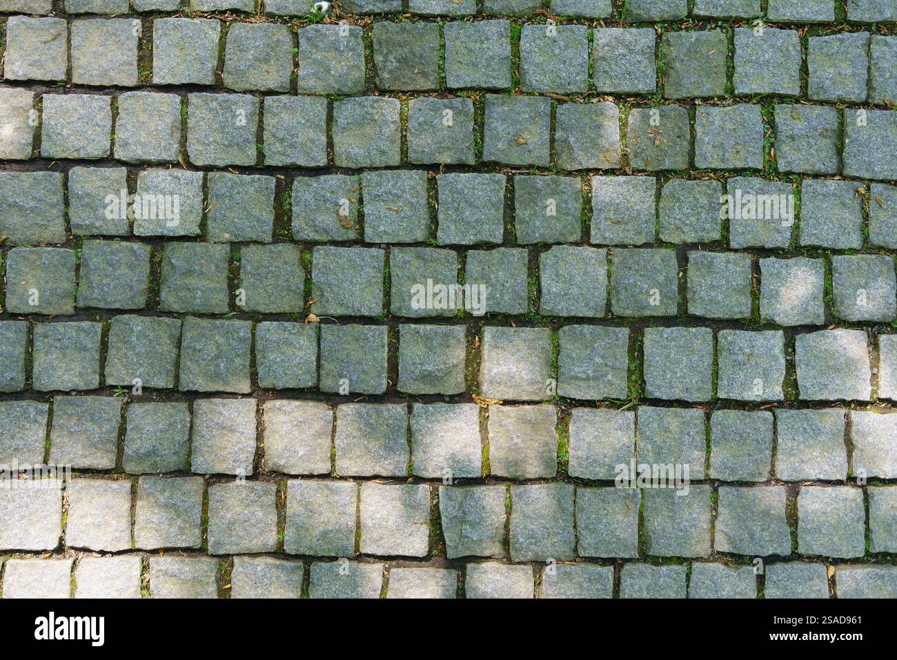 Park path made of cubic natural stone. Textured surface detail Stock ...