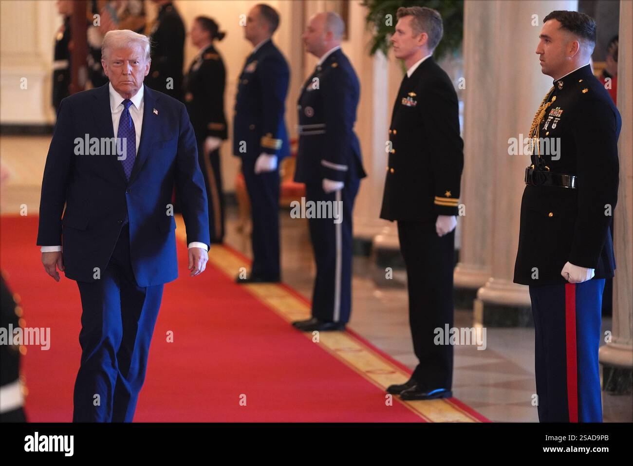 President Donald Trump arrives before signing the Laken Riley Act in ...