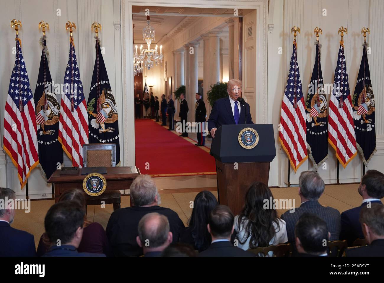President Donald Trump speaks before signing the Laken Riley Act in the ...