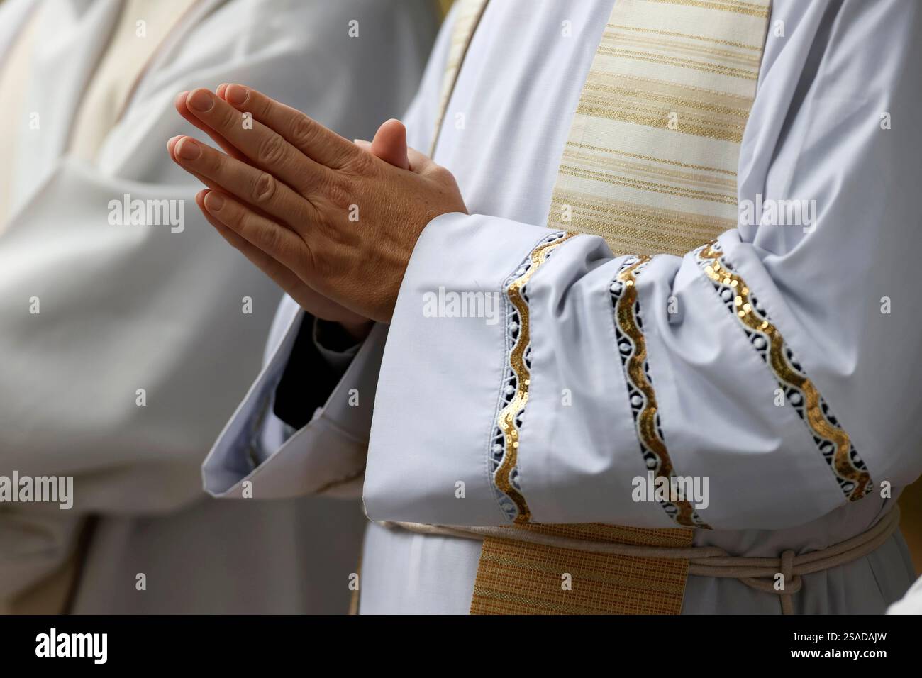Catholic mass. Lord's Prayer. Priest praying. Close-up on hands. La ...
