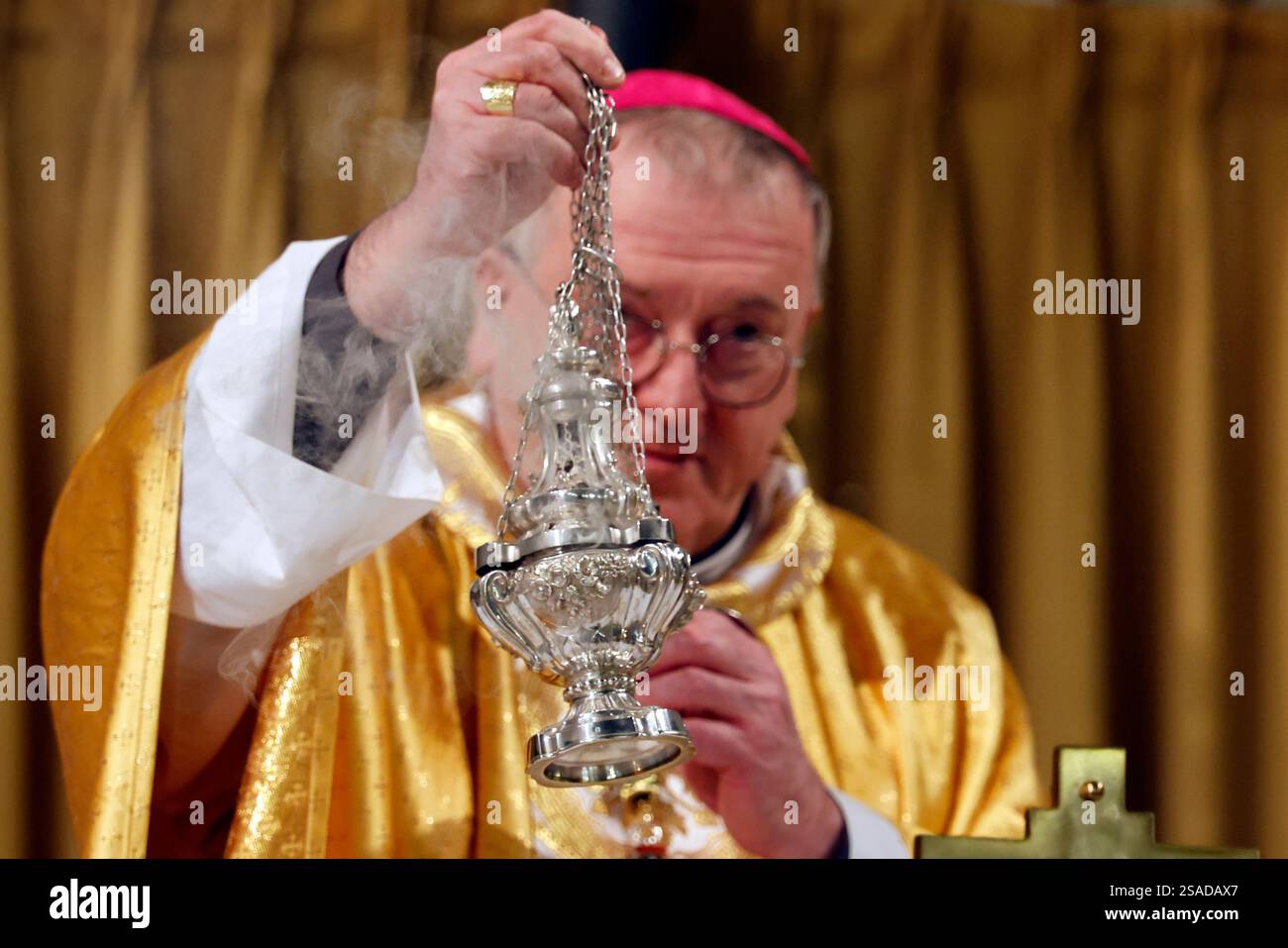 Basilica of the visitation. Catholic mass. Bishop with a censer for the ...