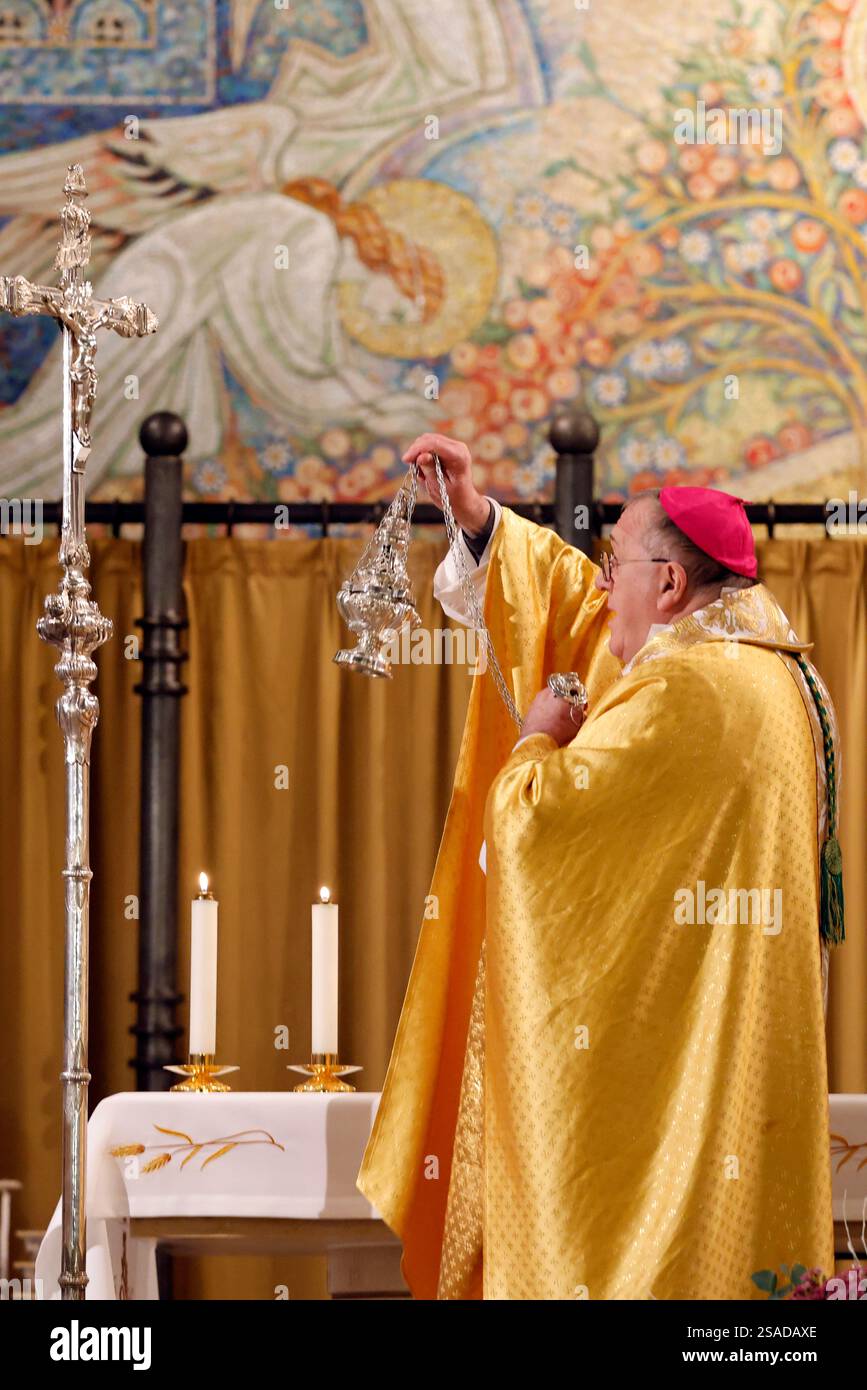 Basilica of the visitation. Catholic mass. Bishop with a censer for the ...