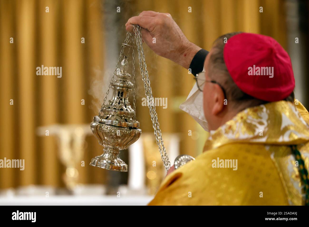 Basilica of the visitation. Catholic mass. Bishop with a censer for the ...