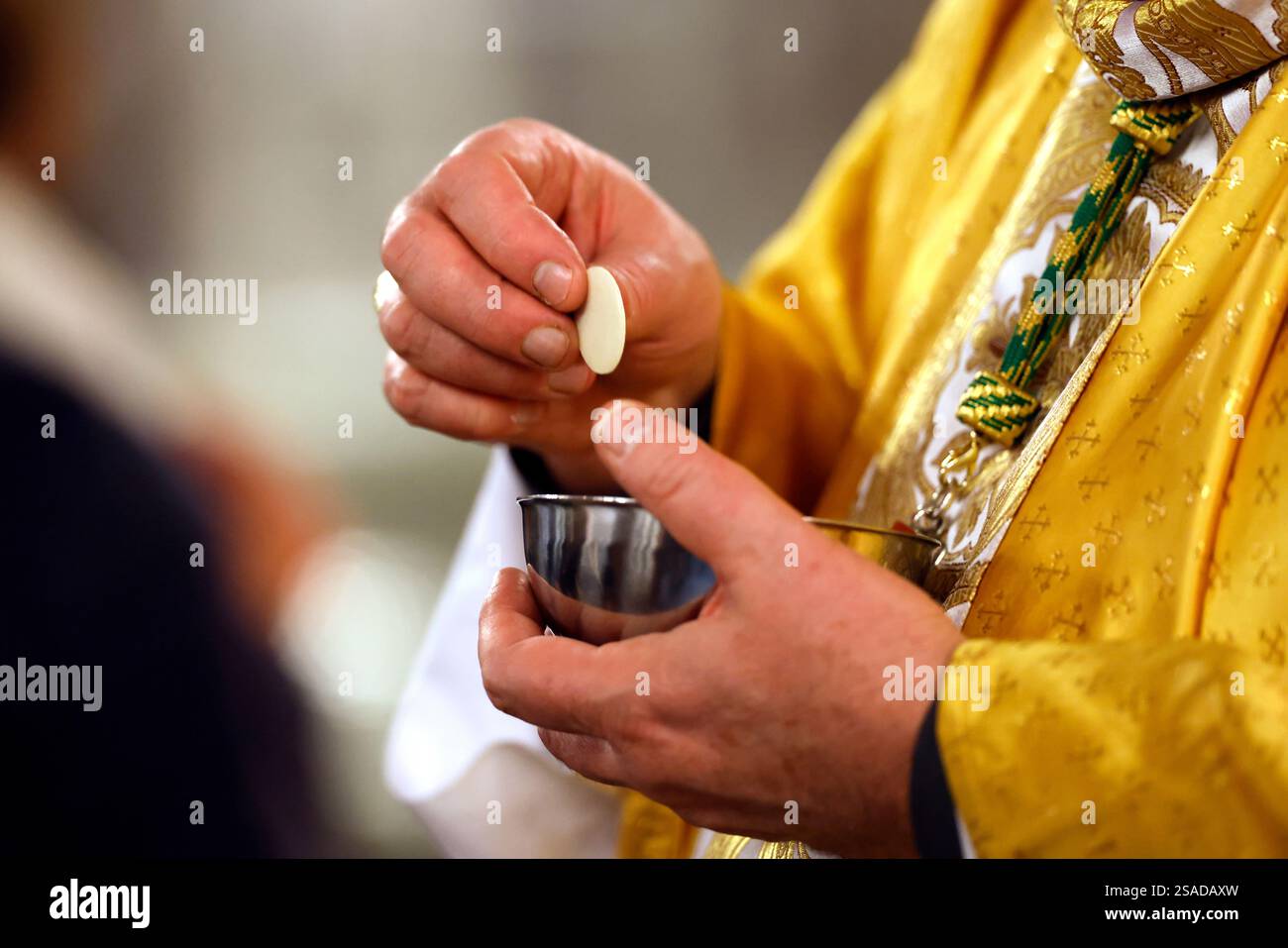 Basilica of the visitation. Catholic mass. Bishop giving Holy Communion ...