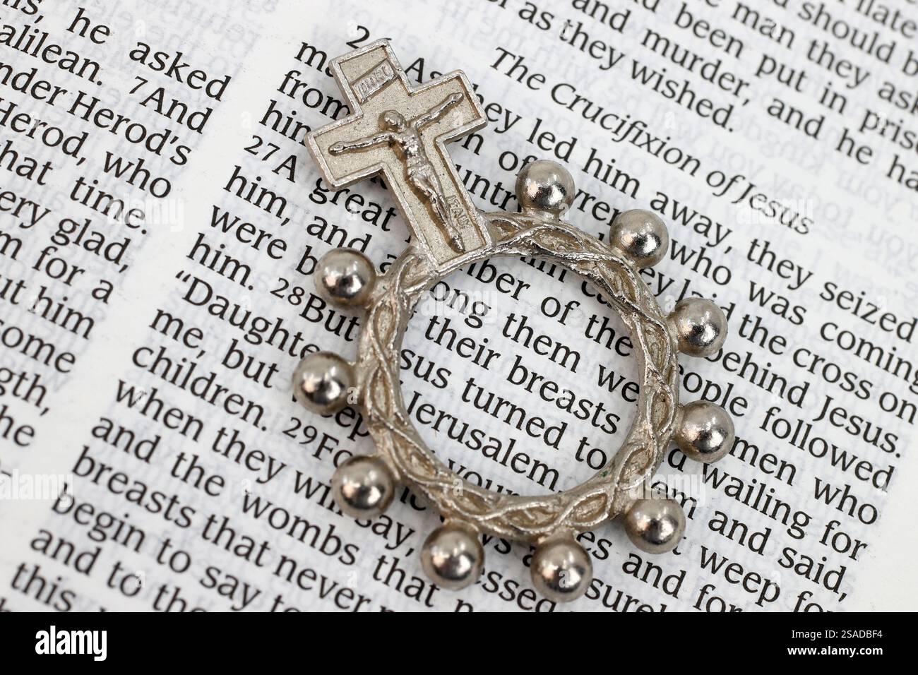 Open bible with rosary ring and crucifix. Symbol of Christianity. The ...