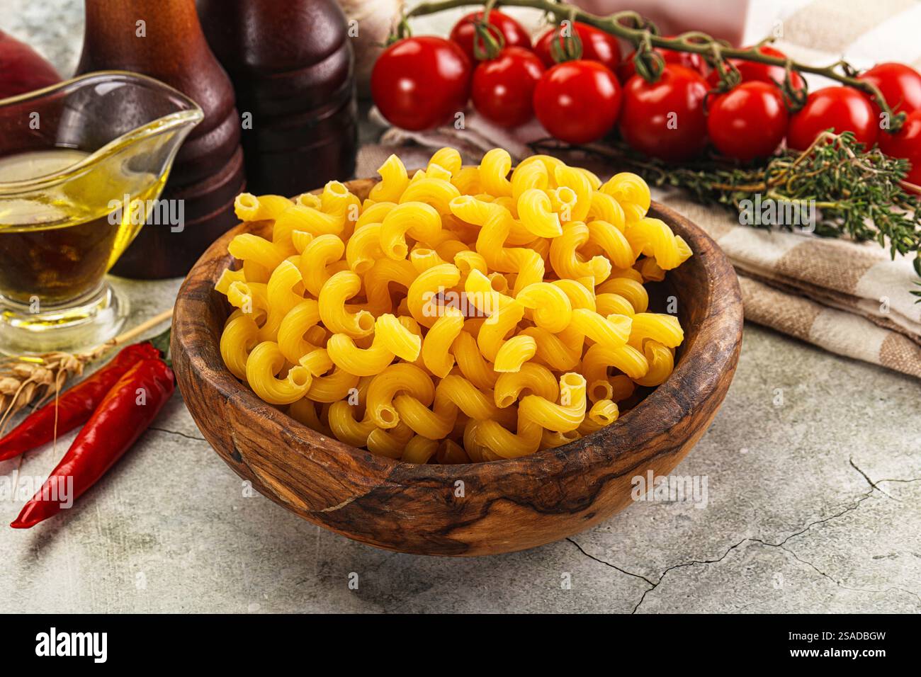 Italian cuisine - dry cellentani pasta for cooking Stock Photo - Alamy