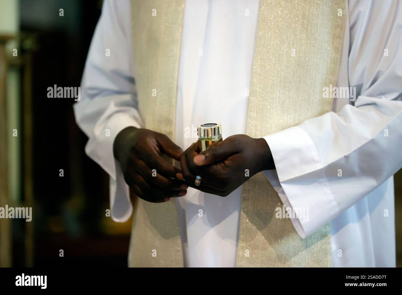 Parish of Saint George. Catholic baptism ceremony. Priest with Holy ...
