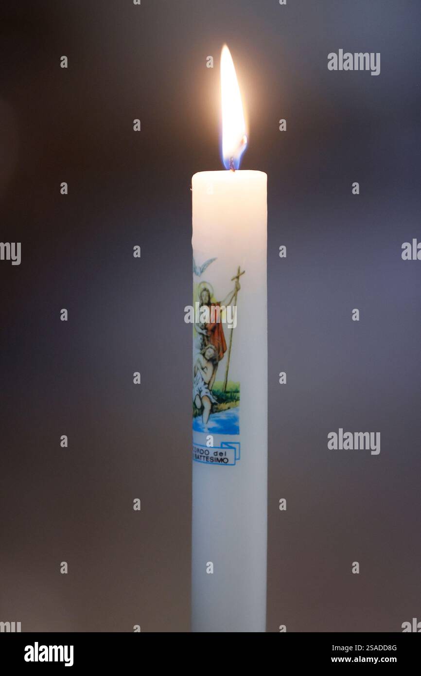 Parish of Saint George. Catholic baptism ceremony. Baptismal candle ...