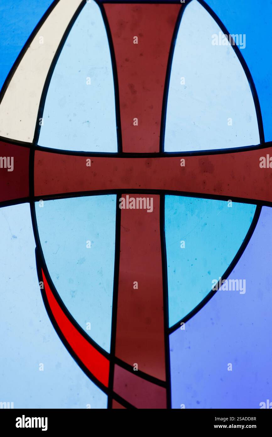 Parish of Saint George. Stained glass window. Christian cross ...
