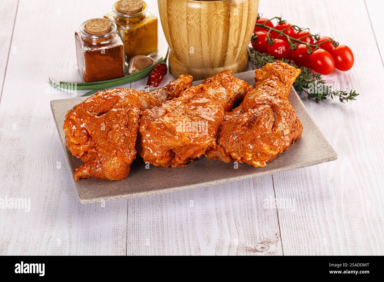 Raw turkey shoulder wing in Indian tandoori marinade spices Stock Photo ...