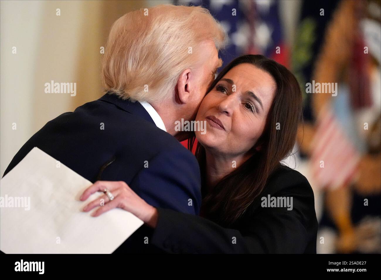 President Donald Trump hugs Allyson Phillips, mother of Laken Riley ...
