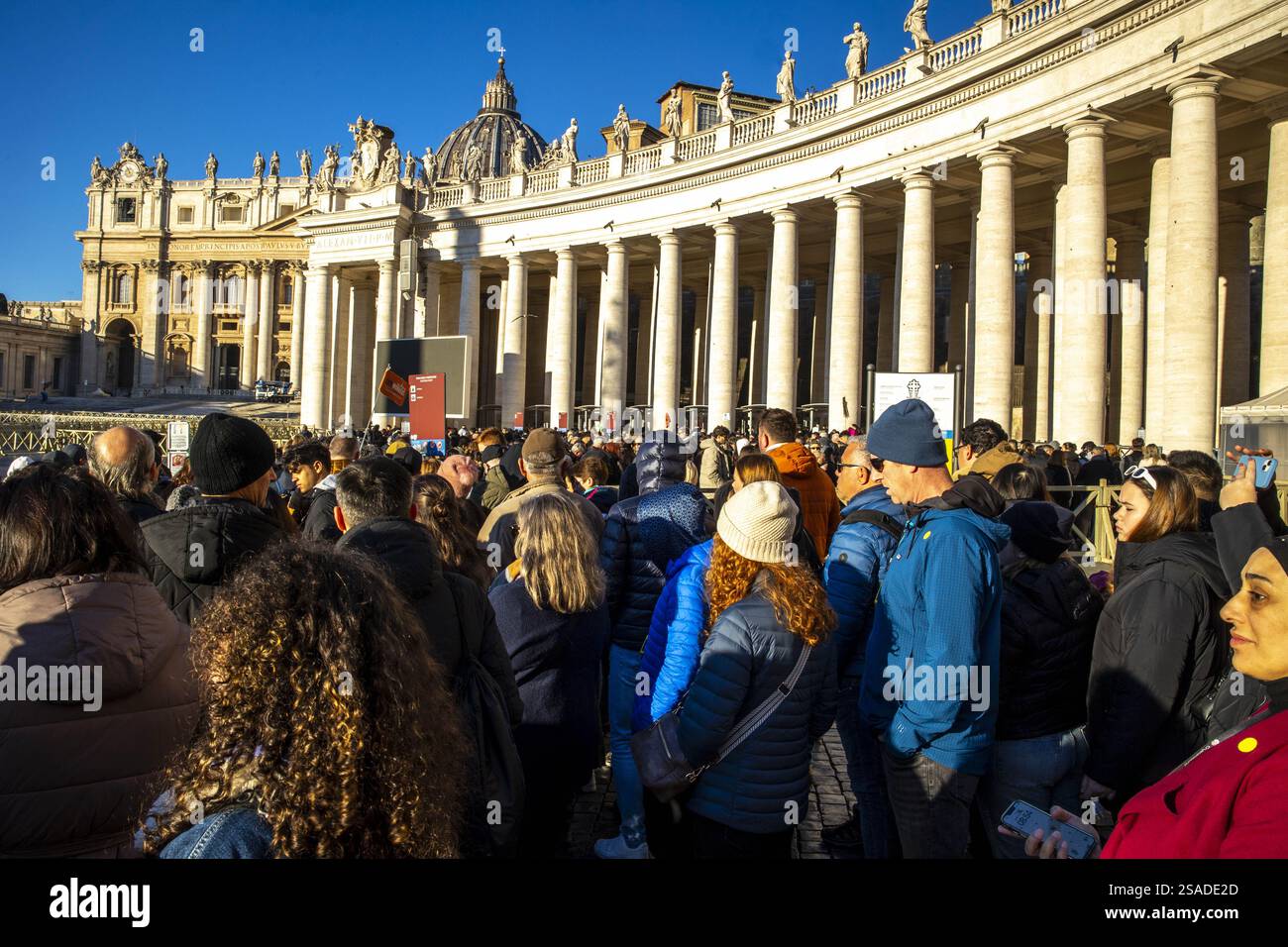 Tourists queuing to enter St. Peter's basilica, during the Catholic ...