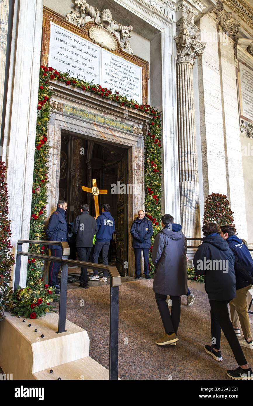 Pilgrims entering St. Peter's basilica through the Holy Door during the ...