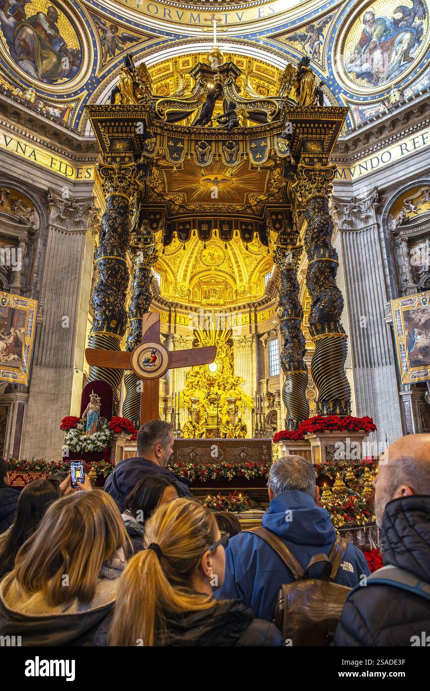 Pilgrims carrying Jubilee cross in St. Peter's basilica during the ...