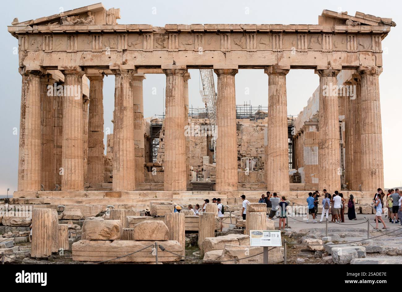 East facade of the Parthenon with lot of tourists in front of it in ancient Acropolis. Athens ...