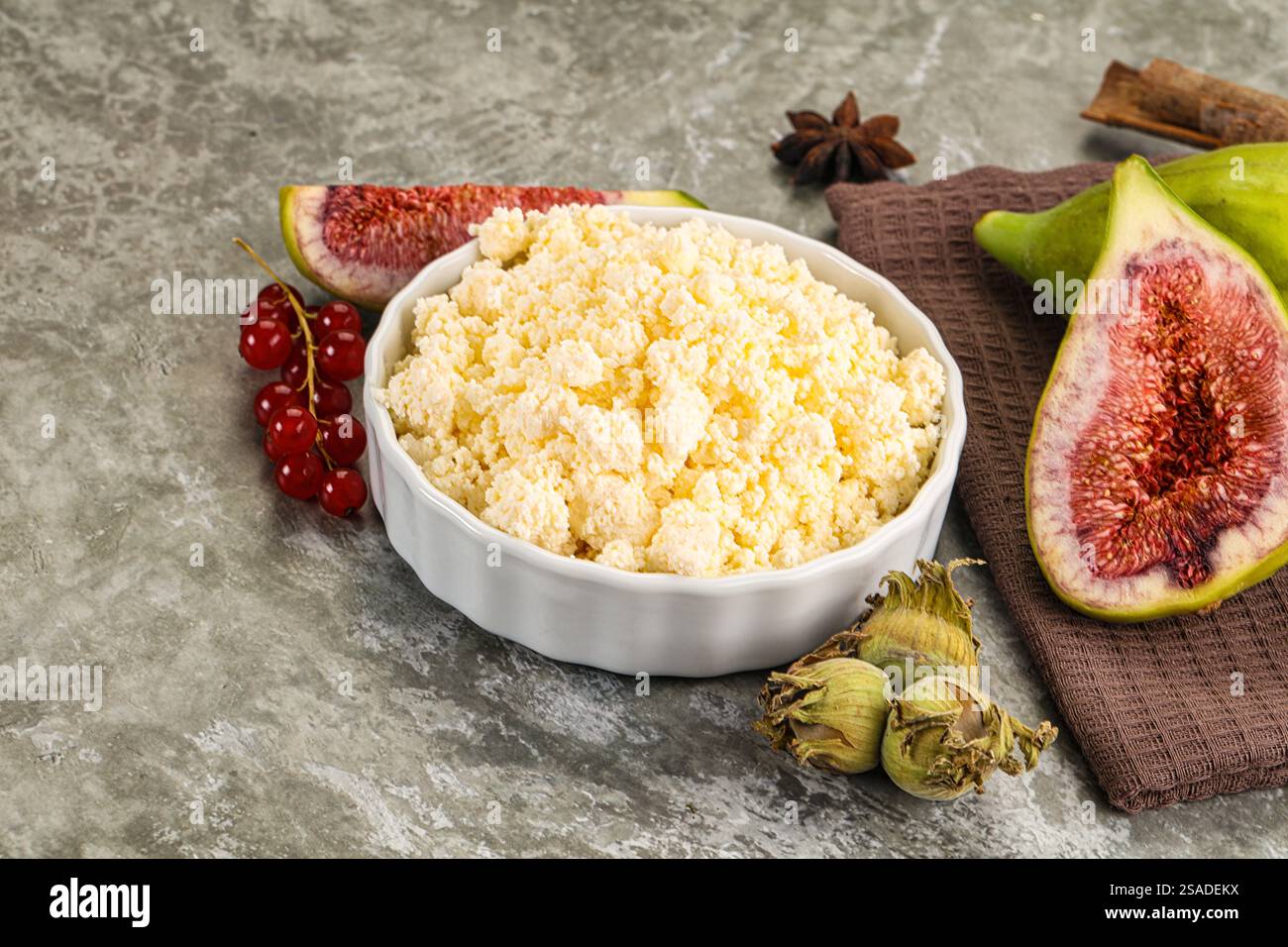 Delicous sheep cottage cheese curd served fig Stock Photo - Alamy