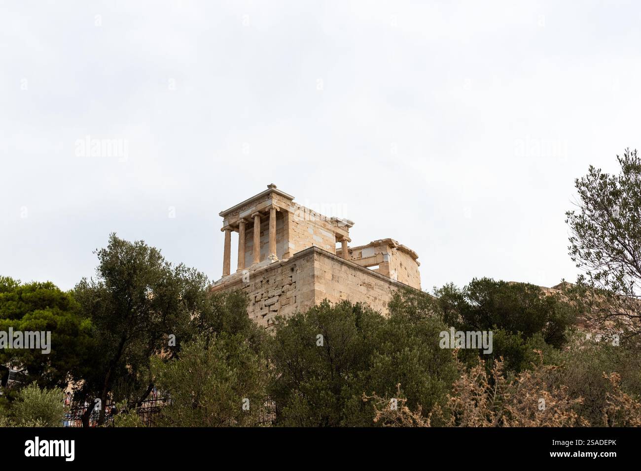 Temple of Athena Nike in prominent position on a steep bastion of Acropolis. Ancient building ...