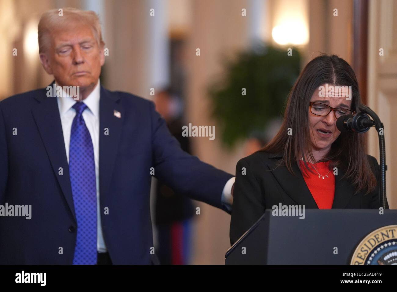 President Donald Trump listens as Allyson Phillips, mother of Laken ...